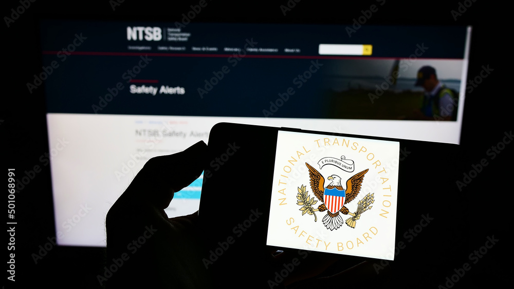 Stuttgart, Germany - 03-29-2022: Person holding cellphone with seal of US National ...