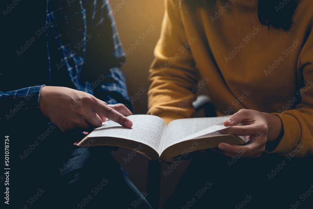 Male reading the Holy Bible by pointing to the character and sharing ...