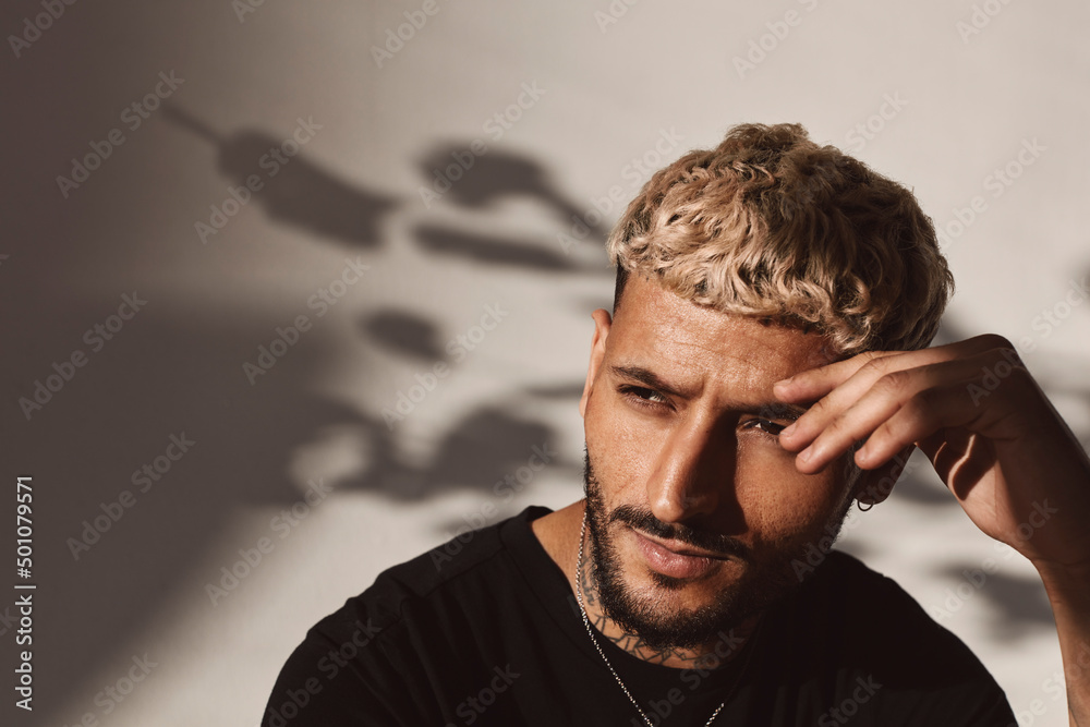 Contemplative young man looking away over white background Stock Photo ... Contemplative young man looking away over white background Stock Photo ...