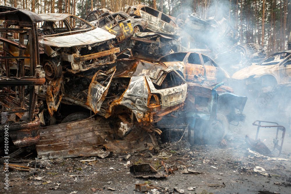 Many shot and destroyed cars of civilians at the car graveyard in Irpin ...