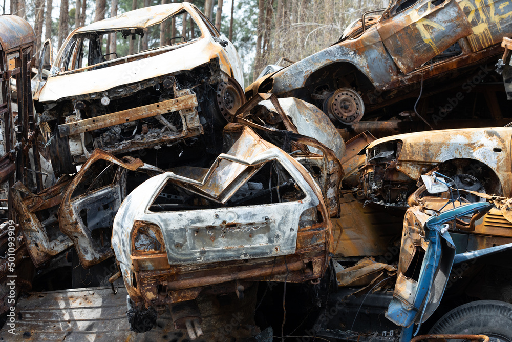 Many shot and destroyed cars of civilians at the car graveyard in Irpin ...