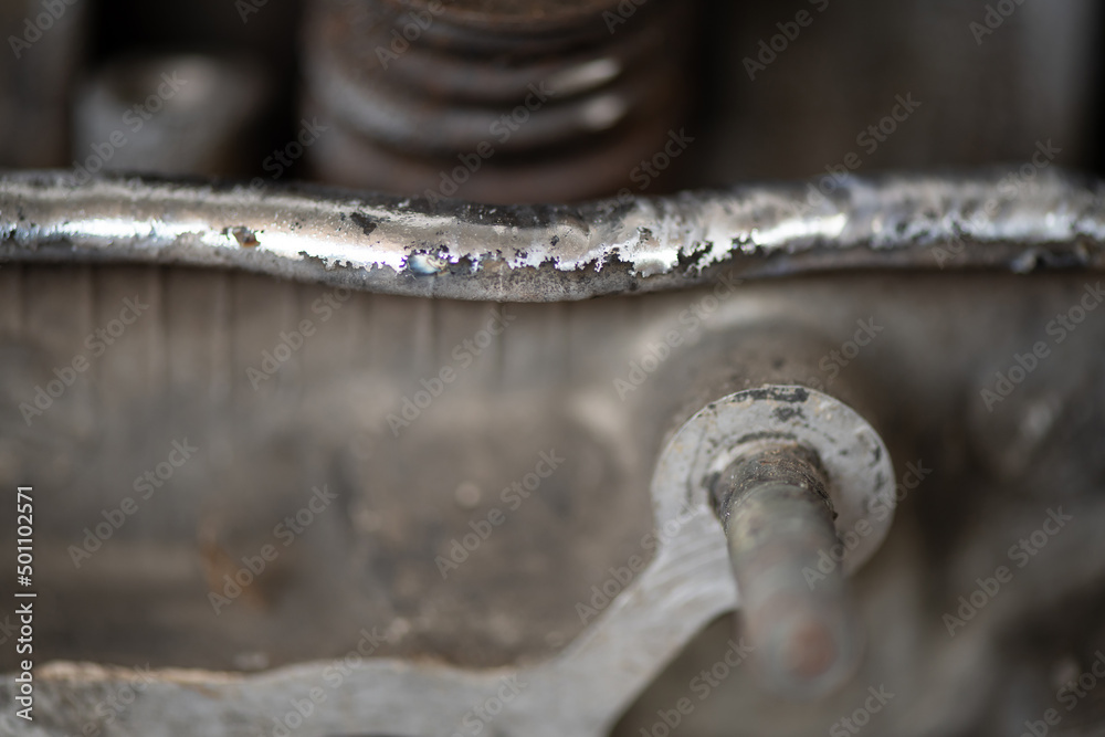 Steel weld joined pipe to plate by arc welding process . rainbow color ...