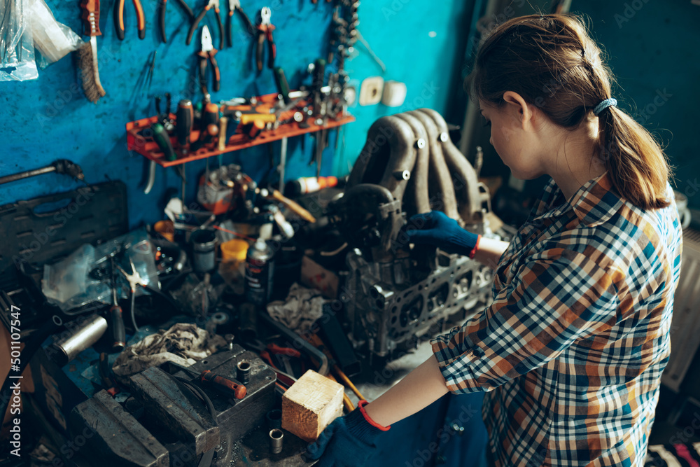 Foto de Destroying gender stereotypes. Young woman auto mechanic ...