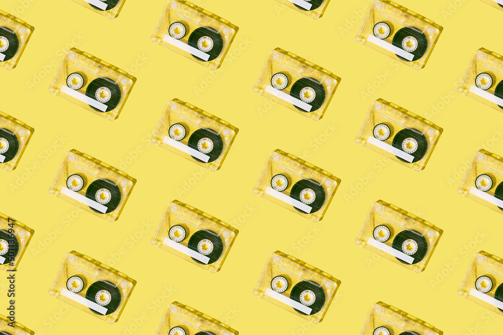 Retro pattern made with cassette tape on vibrant yellow background ...