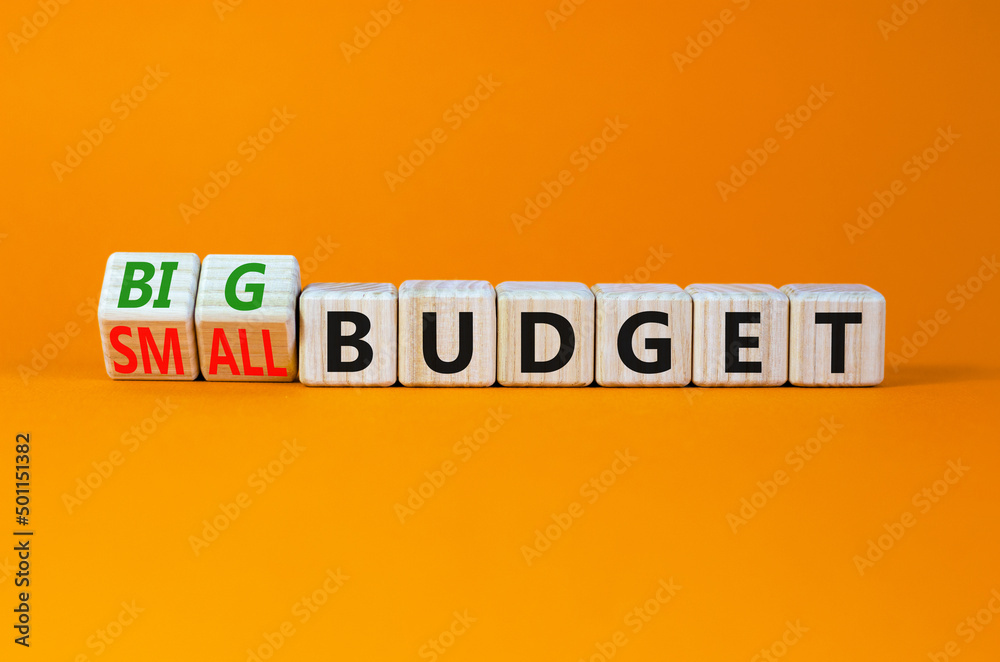 Big or small budget symbol. Turned wooden cubes and changed concept ...