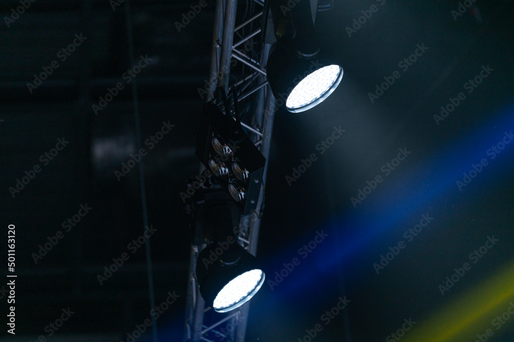 Professional stage lights at the concert stage in green and blue ...