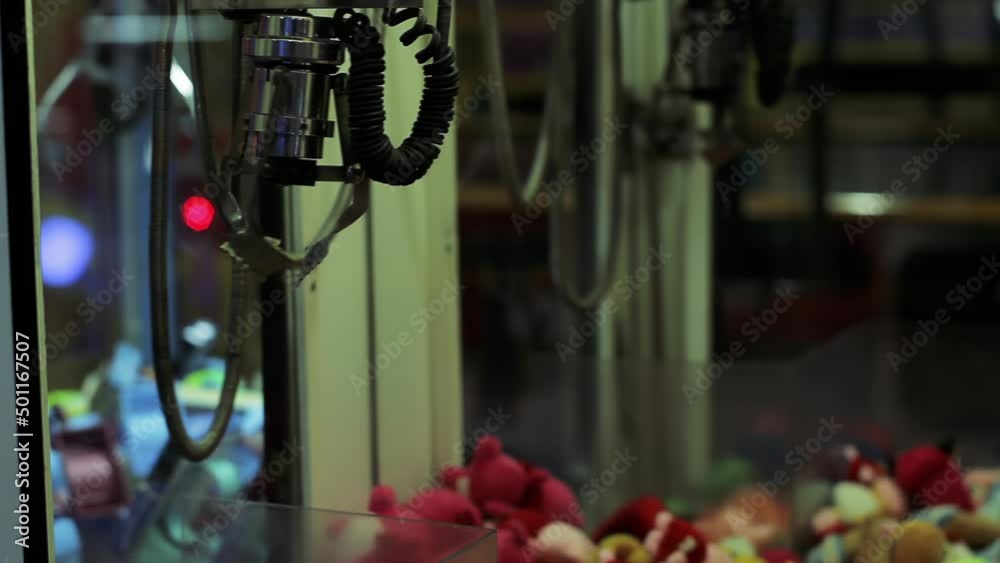 Crane Toy Grabbing Machine, Claw Crane Machine Grabbing a Toy. Close Up ...