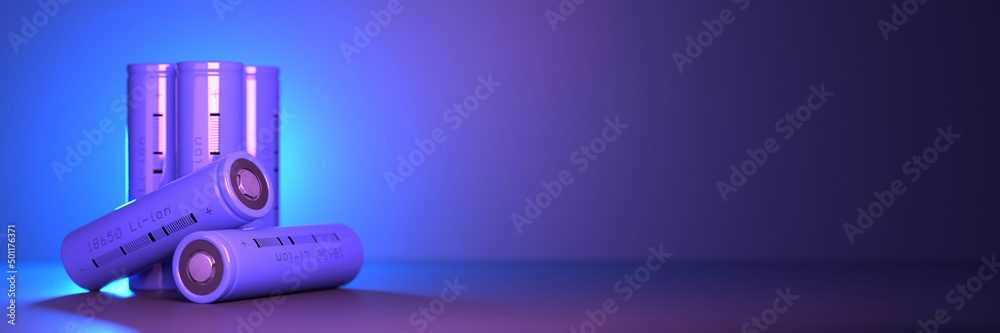 5 purple cylindrical li-ion batteries type 18650 on the table. Wide ...