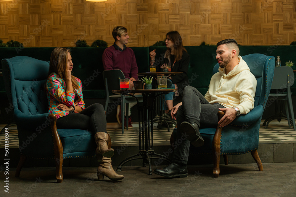 Talking to each other while sitting on different tables Stock Photo ...