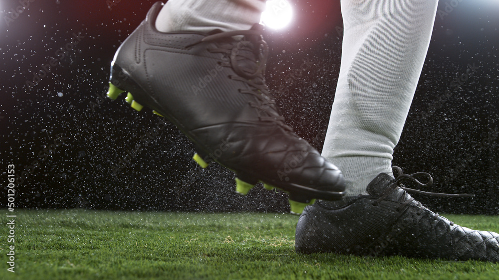 Close-up of Football Player Kicking Soccer Ball Stock Photo | Adobe Stock