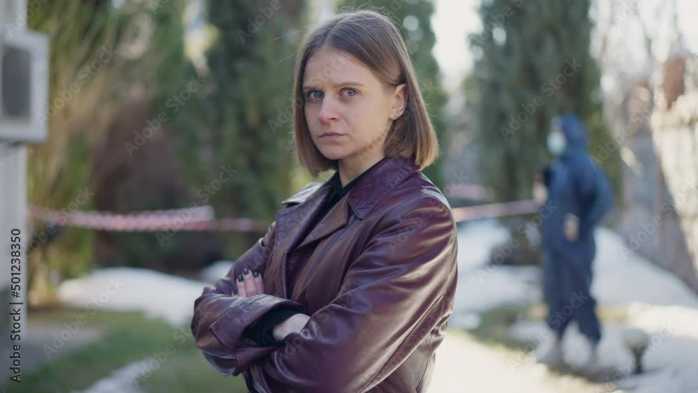 Side view confident charming female detective crossing hands looking at ...
