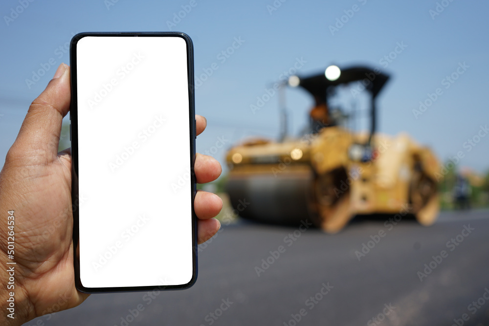Mobile phone and road construction blur background Stock Photo | Adobe ...
