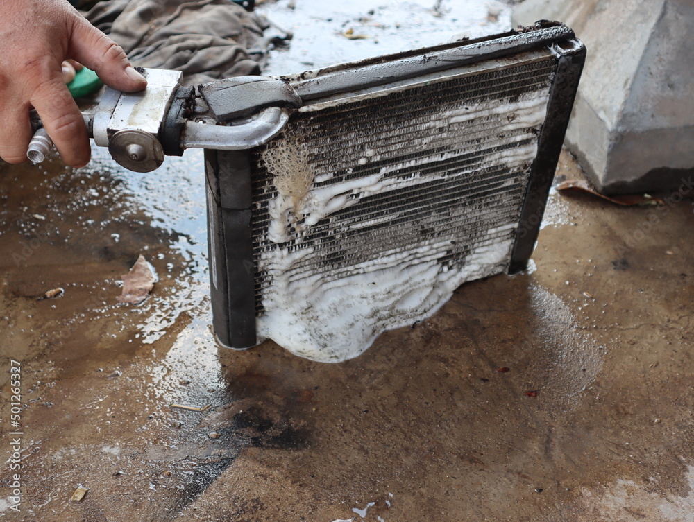 Dirt is caused by cleaning the condenser unit of the car. Stock Photo ...