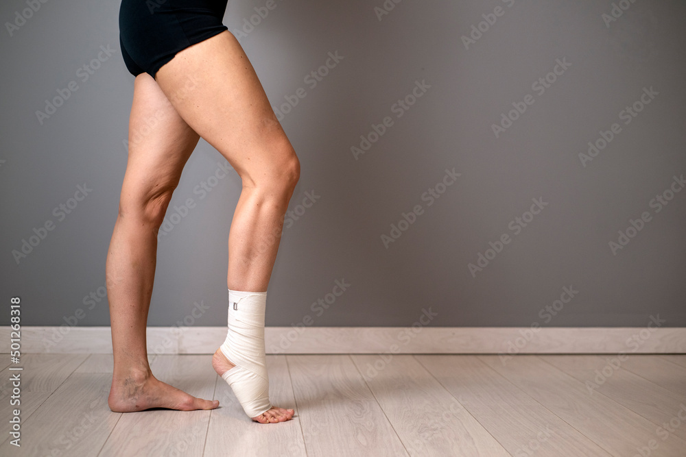 Disabled woman walking with crutches and sprained ankle Stock Photo ...