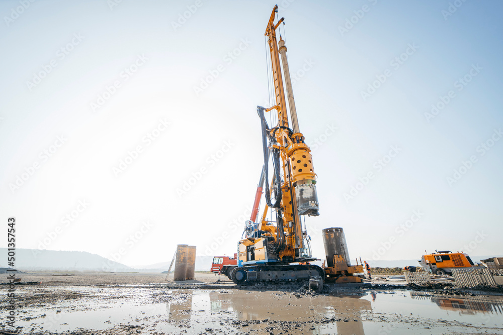 Drilling rig on a construction site. Drilled piles for the bridge ...