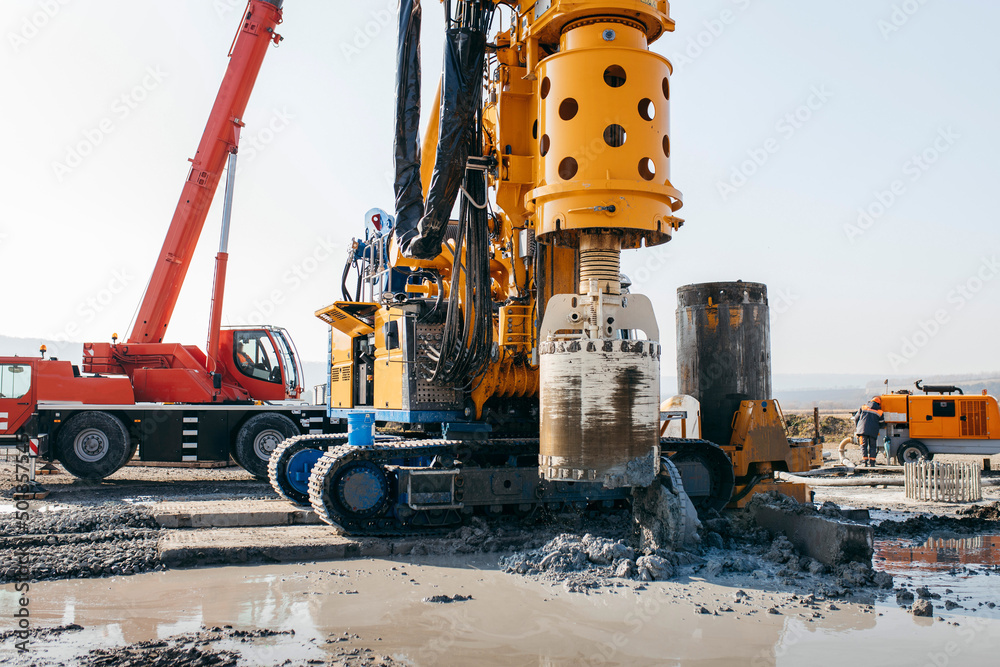 Drilling rig on a construction site. Drilled piles for the bridge ...