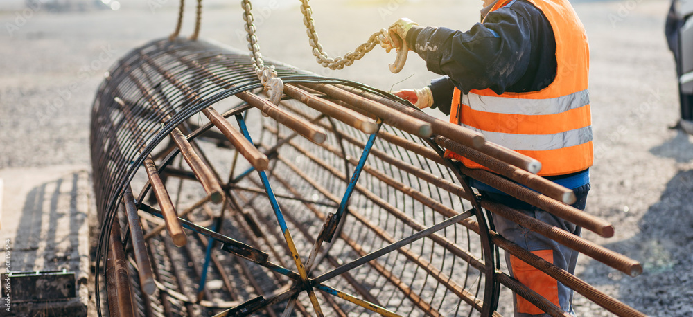 Poster Unloading iron piles from the truck before starting of the ...