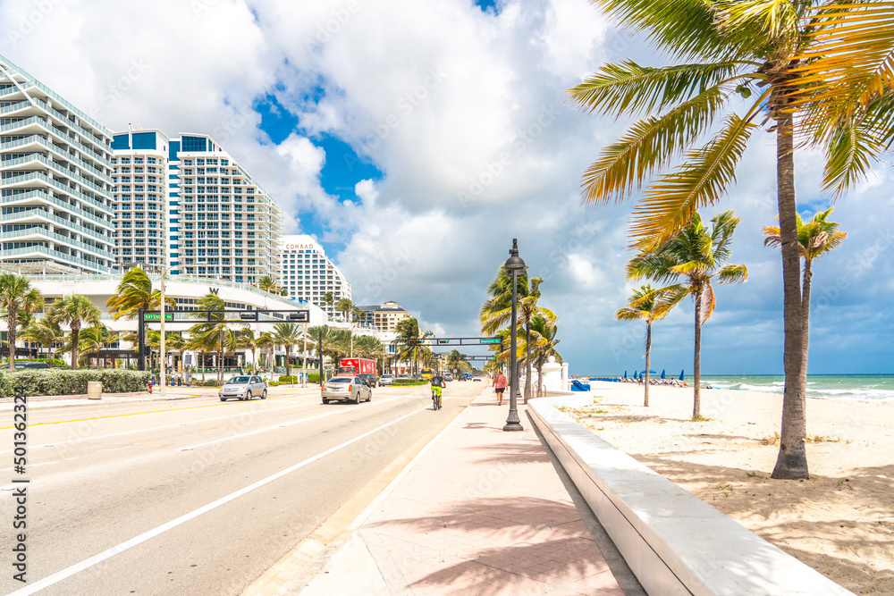 Seafront beach promenade with palm trees on a sunny day in Fort ...