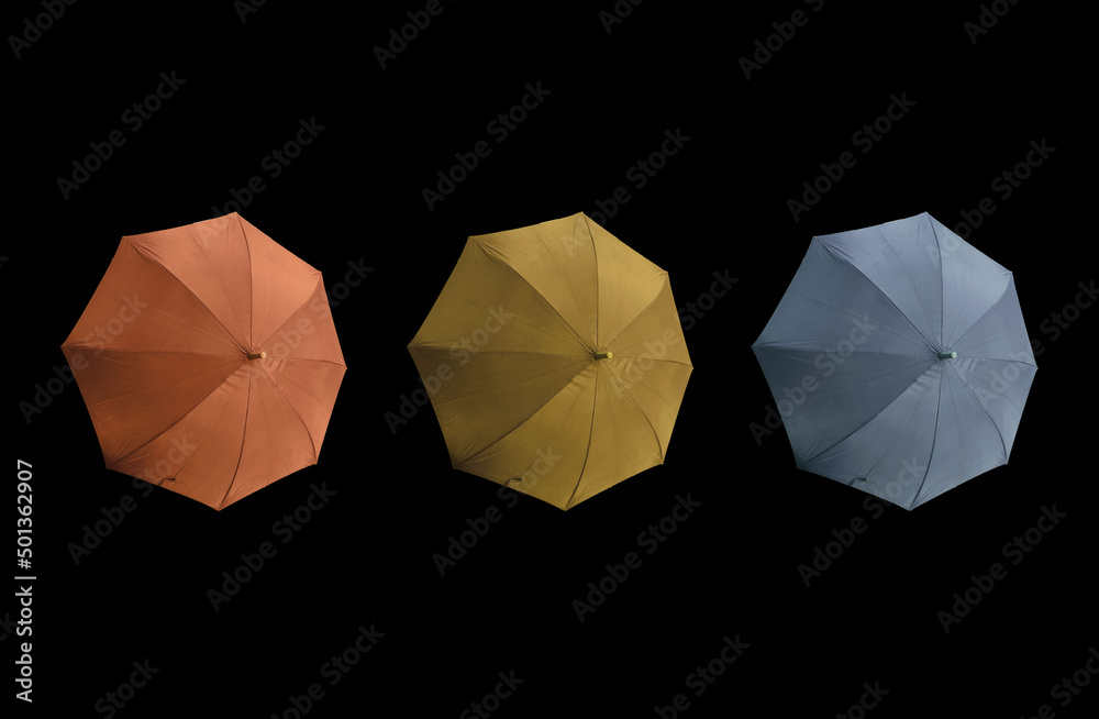 Top view, Set three colours umbrella isolated on black background ...