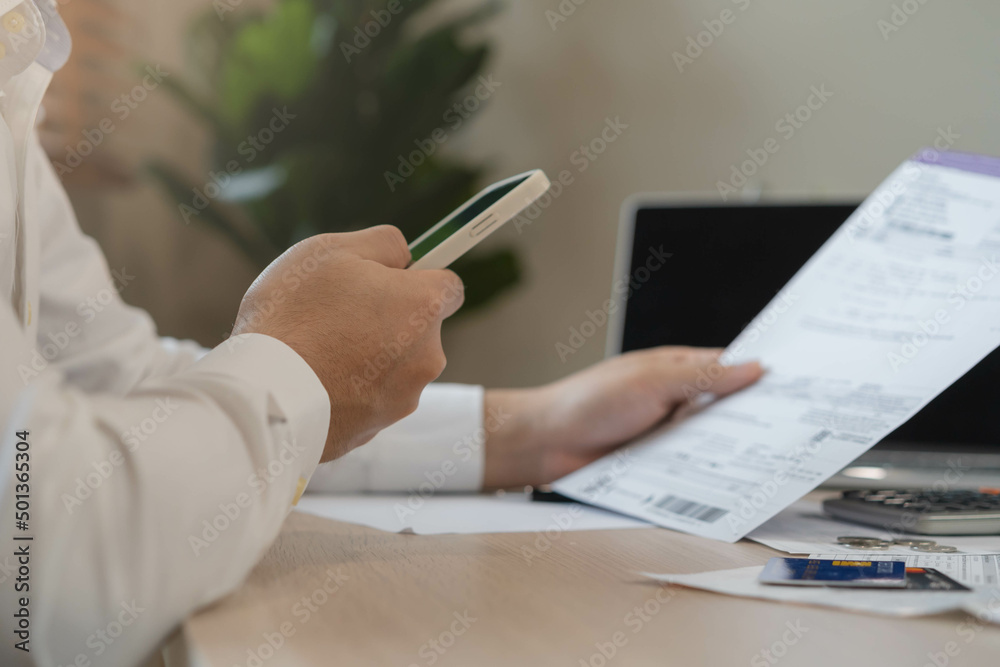 Cost, budget asian young man calculate expense, spending and check from ...