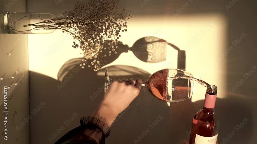 Vidéo Stock Close up of hand of woman pouring delicious rose wine from ...