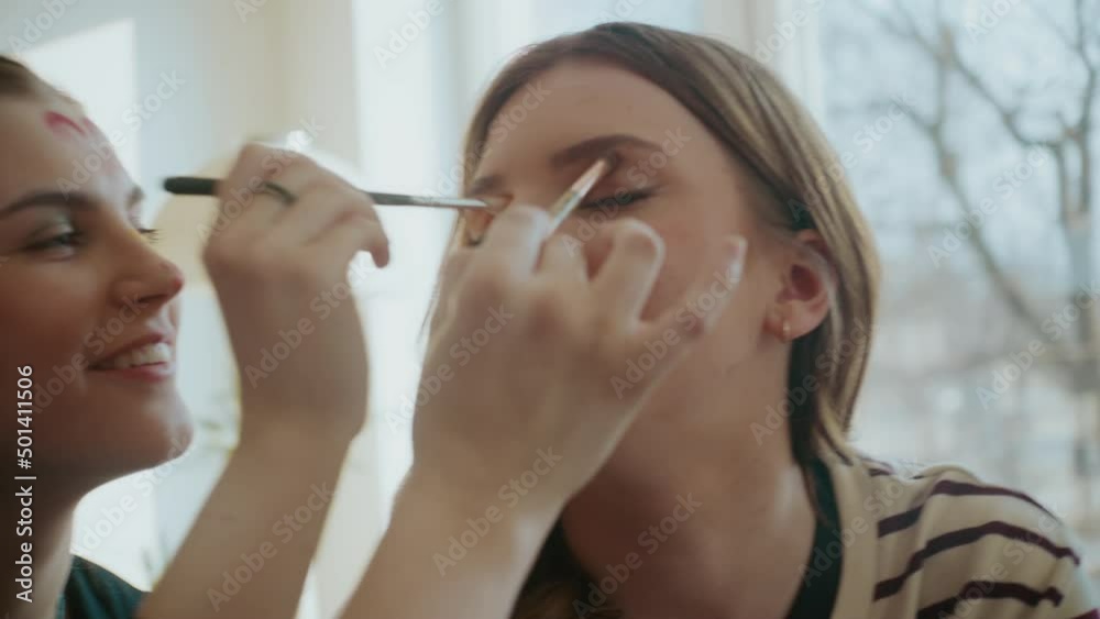 Three Young Teenage Girls Having Fun and Putting On Makeup As a Joke ...