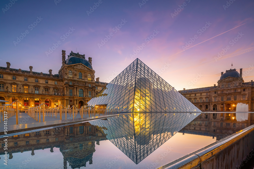 The Louvre Museum and Louvre Pyramid in Paris, France at sunrise Stock ...