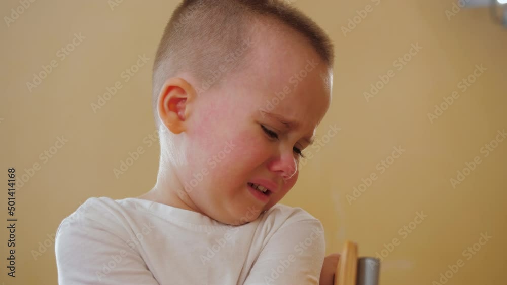 Portrait of little boy crying and sobbing, domestic violence concept ...