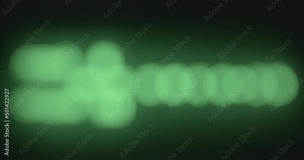 Bokeh electronic device power indicator green color. Light emitting ...