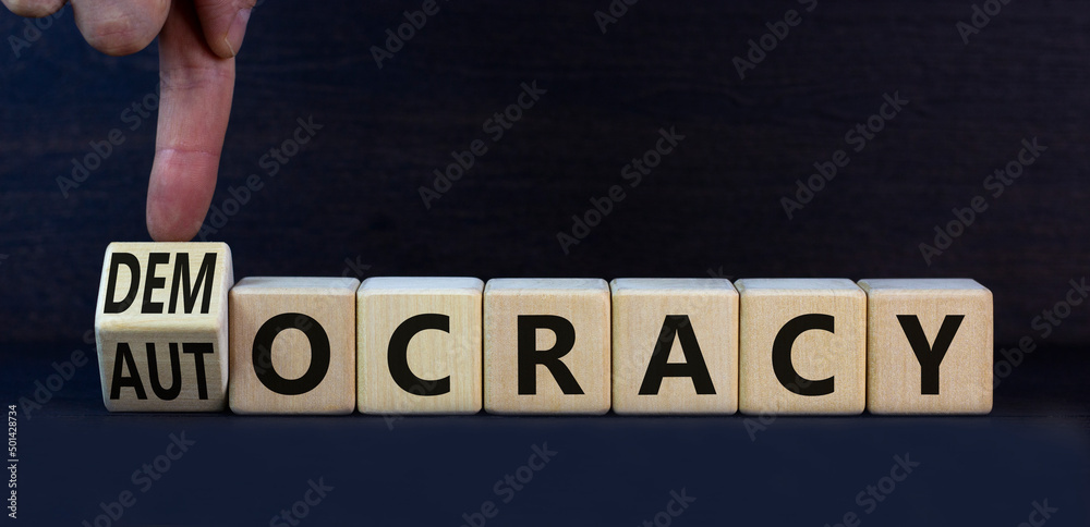 Democracy or autocracy symbol. Turned wooden cubes and changed the ...