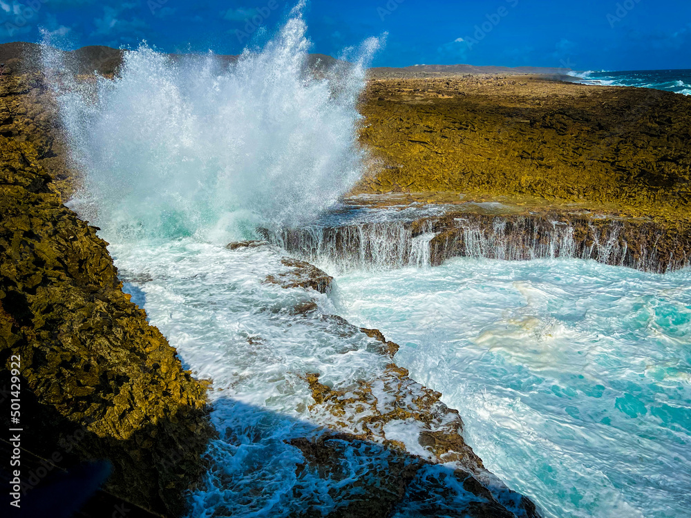 Boka Pistol waves pounding into the inlet at Shete Boka National Park ...
