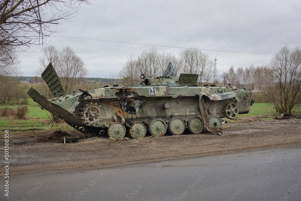 Military armored vehicles on the road. Army armored car blown up. War ...