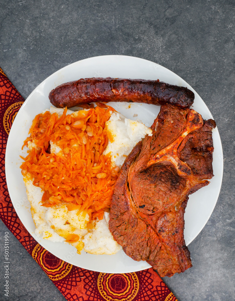 Flat lay of Traditional South African Braai or Shisa nyama, meat cooked ...