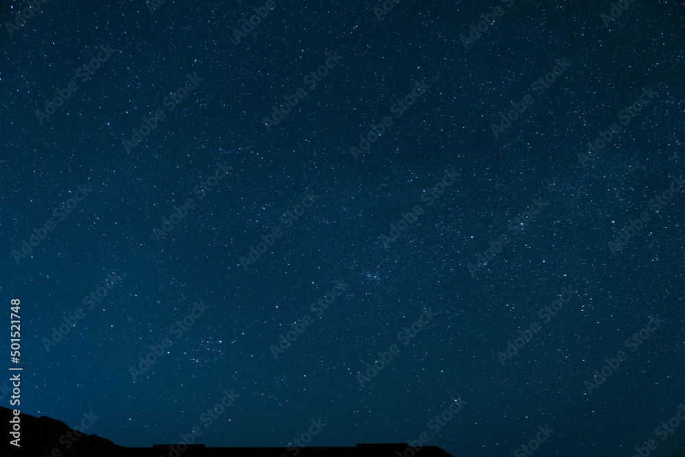 Beautiful night landscape. Stars in a clear sky without moon and clouds ...