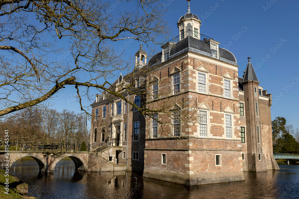 Stone bridge access to moated brick exterior facade of the Ruurlo ...