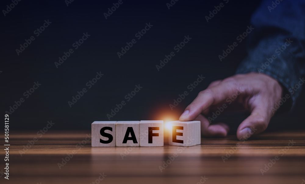 Hand touch wood cube safe concept for safety safe zone or safe care ...