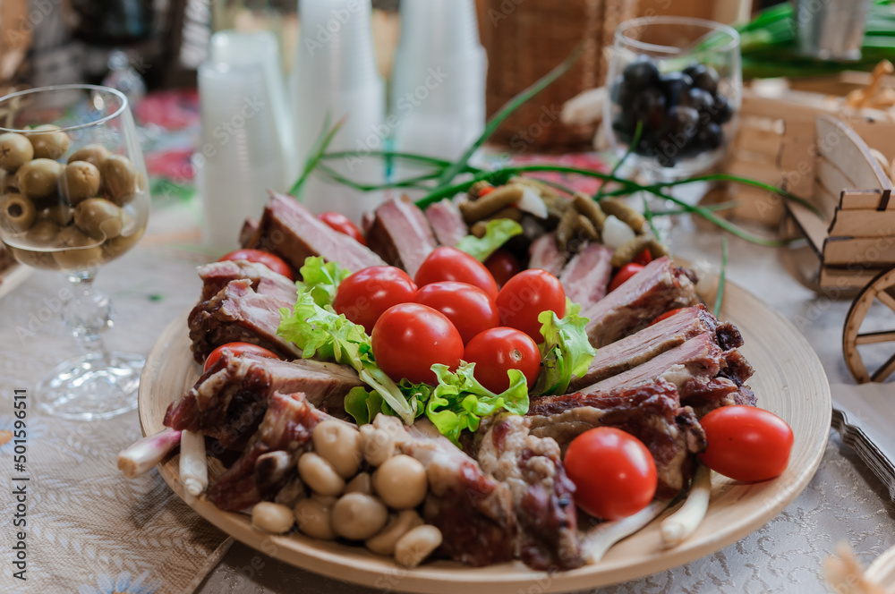 Slicing different types of meat. Meat snacks on the table. wedding ...