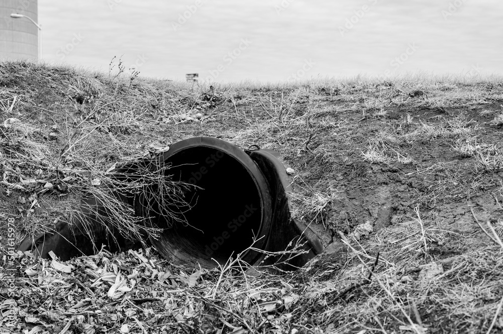 HDPE drainage culvert under a road entrance. Pipe is used to convey ...