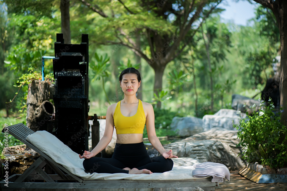 woman doing yoga. Asian yoga girl doing flexibility yoga exercise on ...