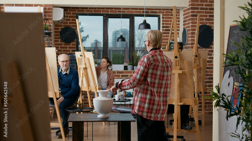 Multiethnic group of people attending art class lesson to learn new ...