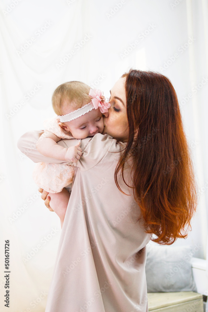 Mother is hugging her little daughter. Maternal hugs. Concept of mother care. Stock Photo ...