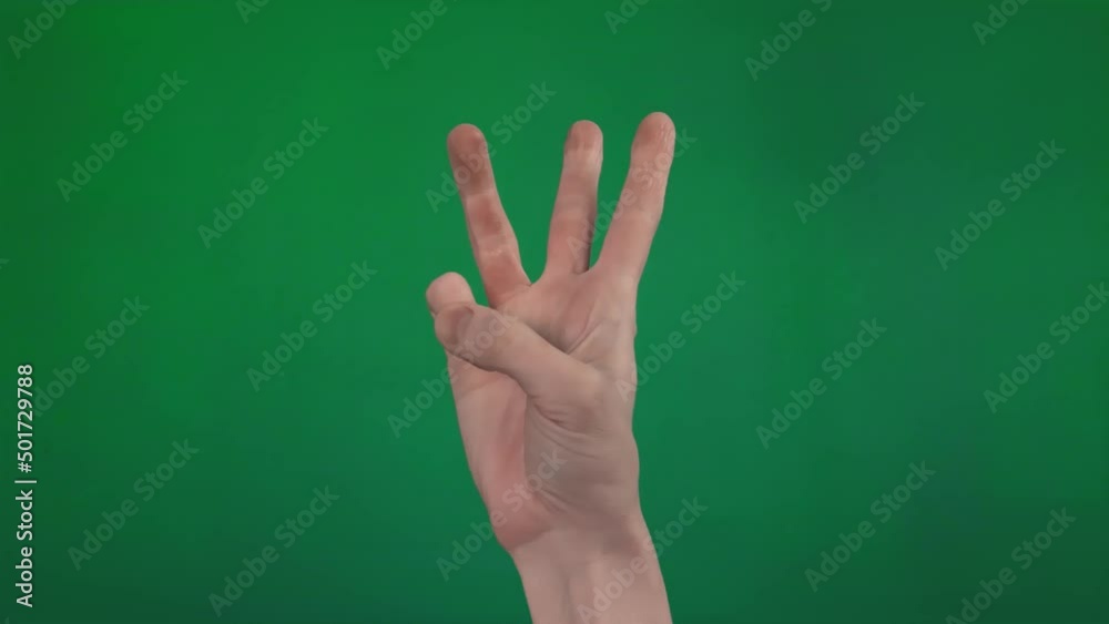 Close up shot of human and raising, making hand gesture counting number ...