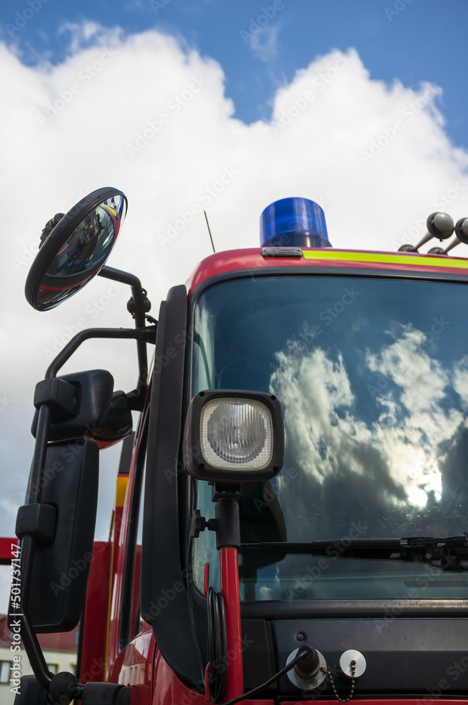 Fire engine with reflective sky and clouds on the windshield. Rescue ...