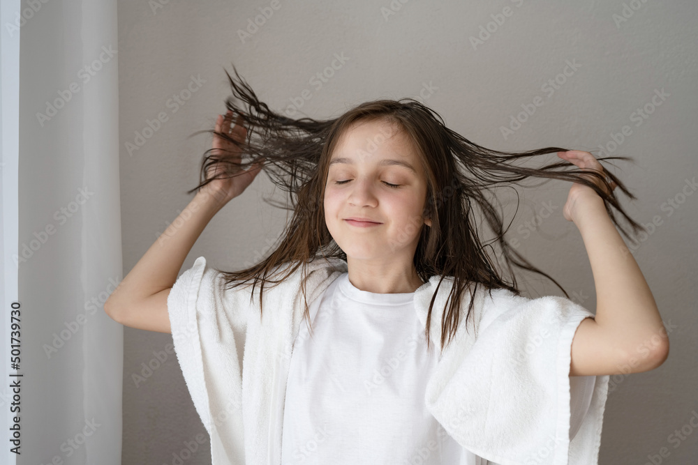 Little girl drying hair with towel Stock Photo | Adobe Stock