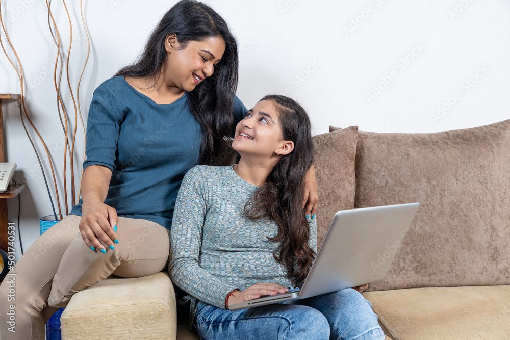 Indian Mother Giving Glass Of Juice To Daughter Mother And Daughter Bonding Foto De Stock