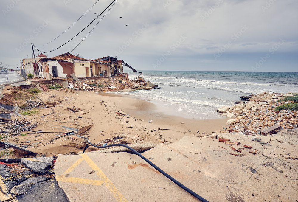 Devastation concept. Waves of high tide created by a tsunami destroys ...
