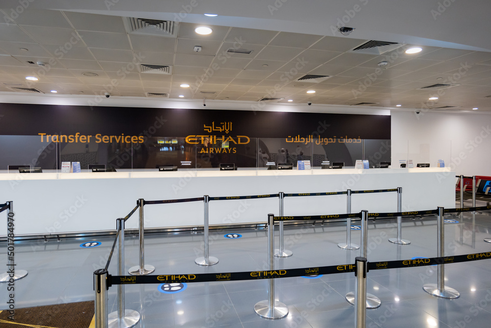 Abu Dhabi, UAE - April 2022: Etihad Airways check-in counter with logo ...