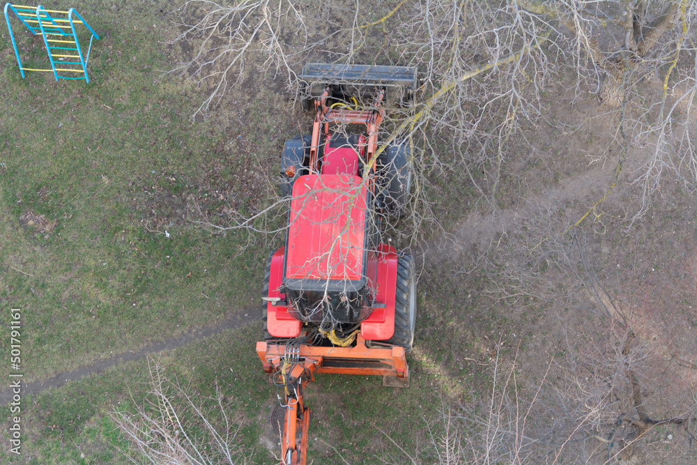 Excavator Tractor digs a hole, top view. The tractor is digging a hole ...