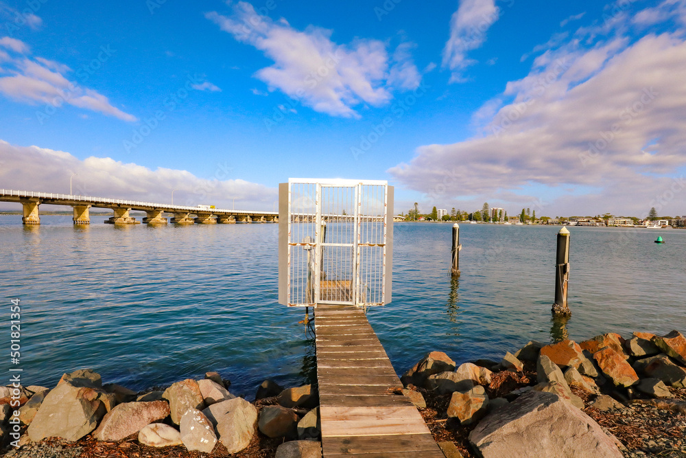 Security gate on small jetty for mooring boat in Wallis Lake with ...