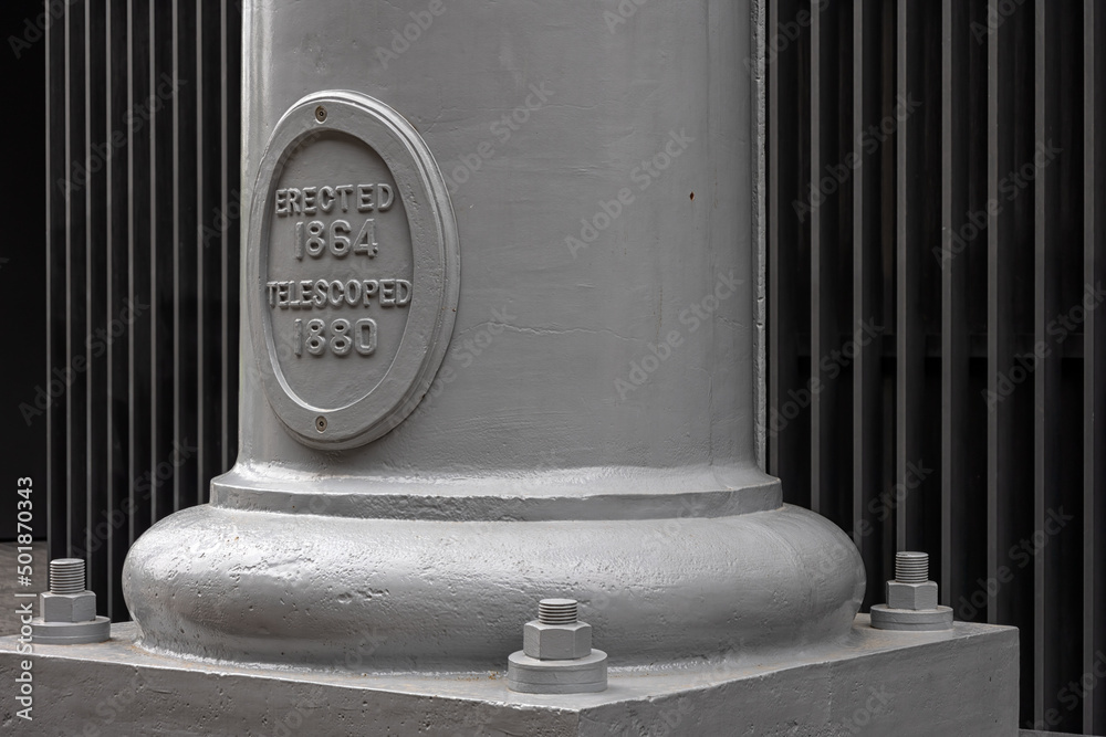 LONDON, UK - APRIL 27, 2022: Sign on supporting cast iron column on the ...